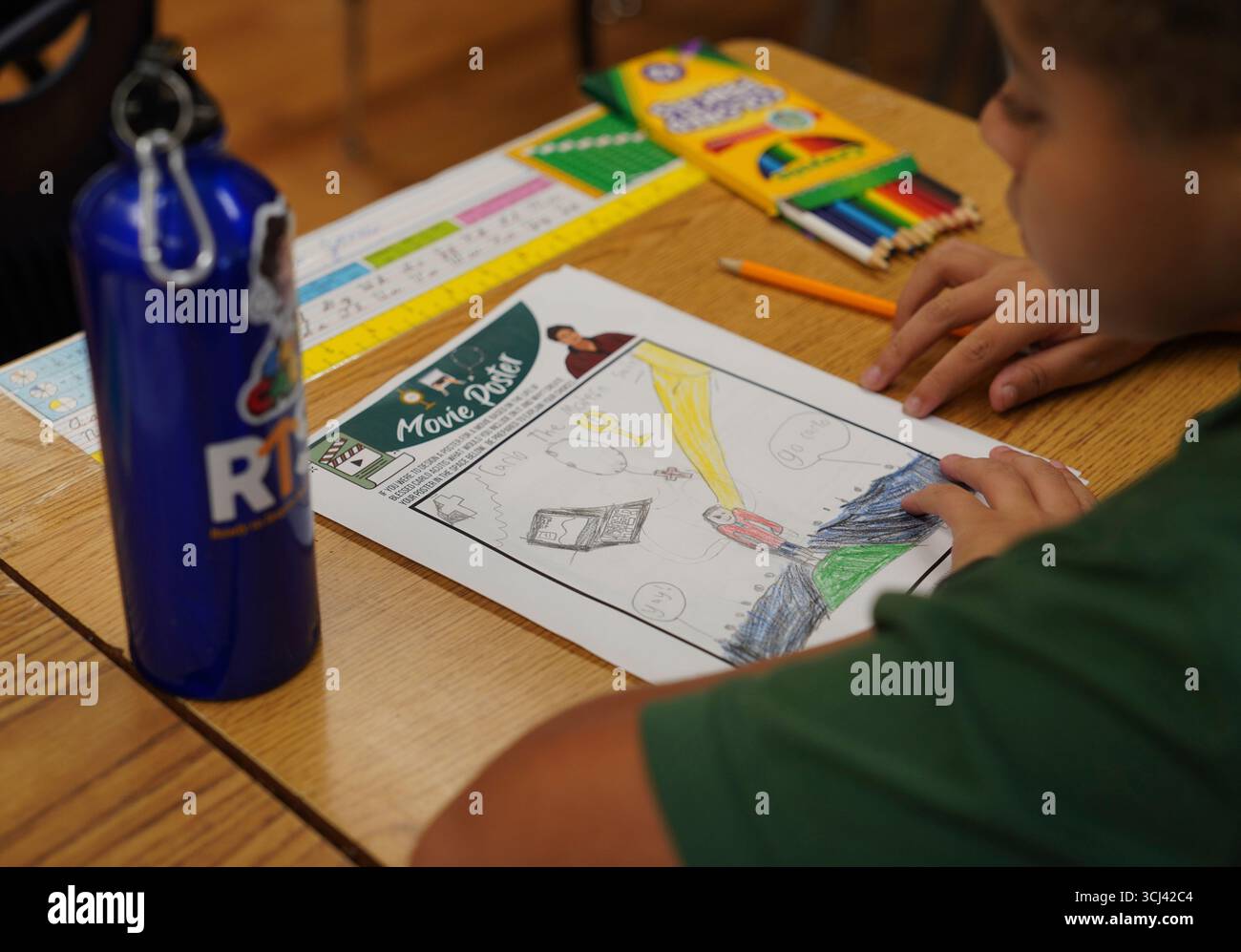 Mateo Jones, a fifth-grade student at St. John Berchmans' school draws ...