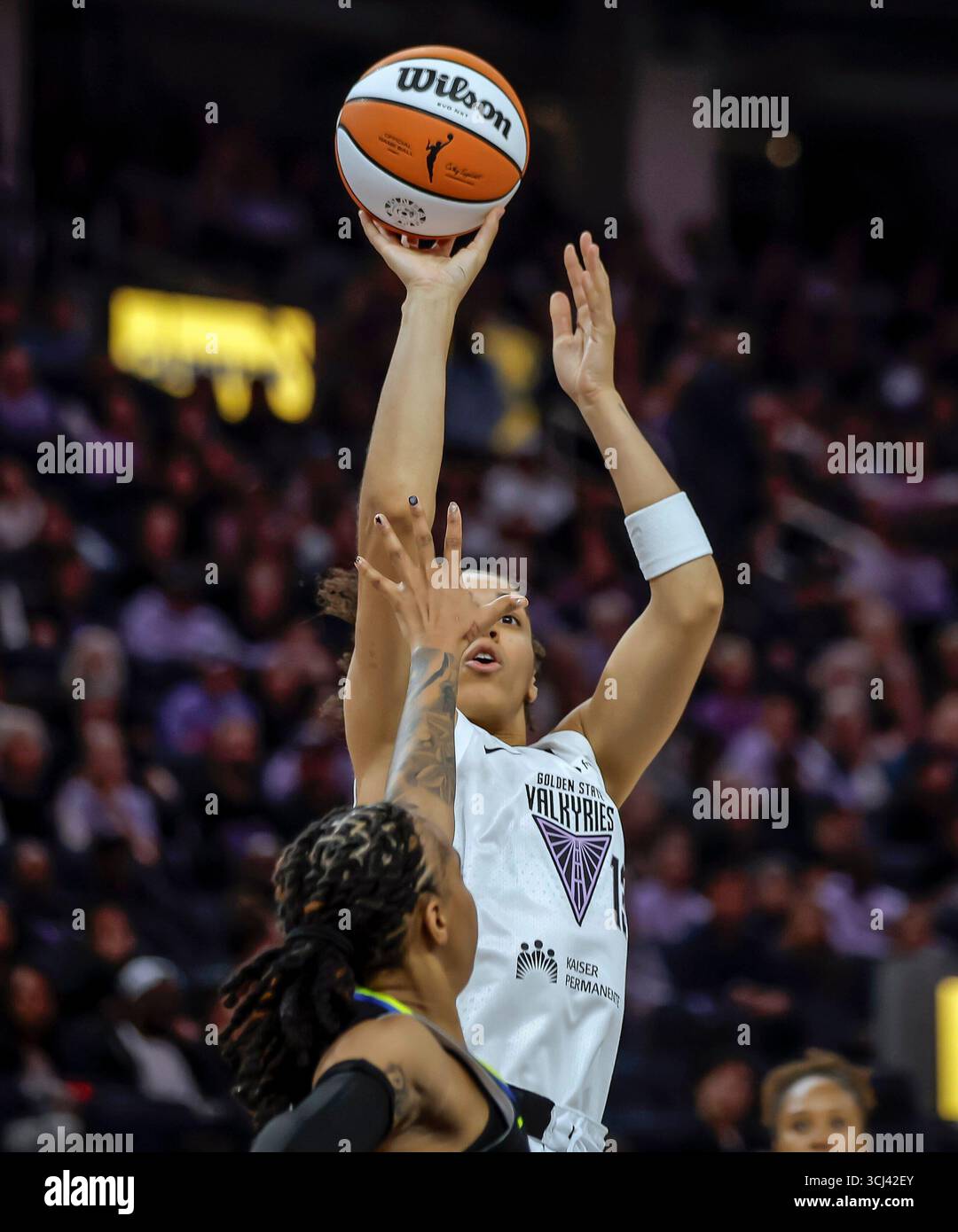 Janelle Salaün (13) puts up a shot in the first half as the Golden ...