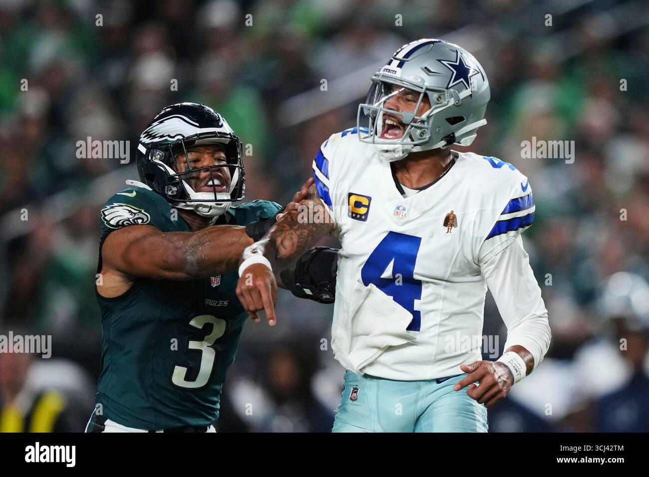 Dallas Cowboys quarterback Dak Prescott (4) releases a pass under pressure from Philadelphia ...