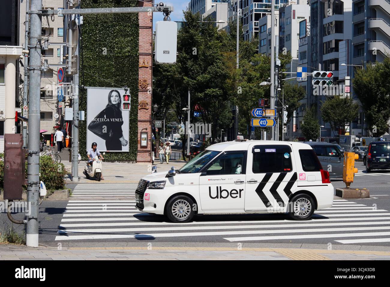 TOKYO, JAPAN - September 2, 2025: A taxi with Uber written on it on a ...