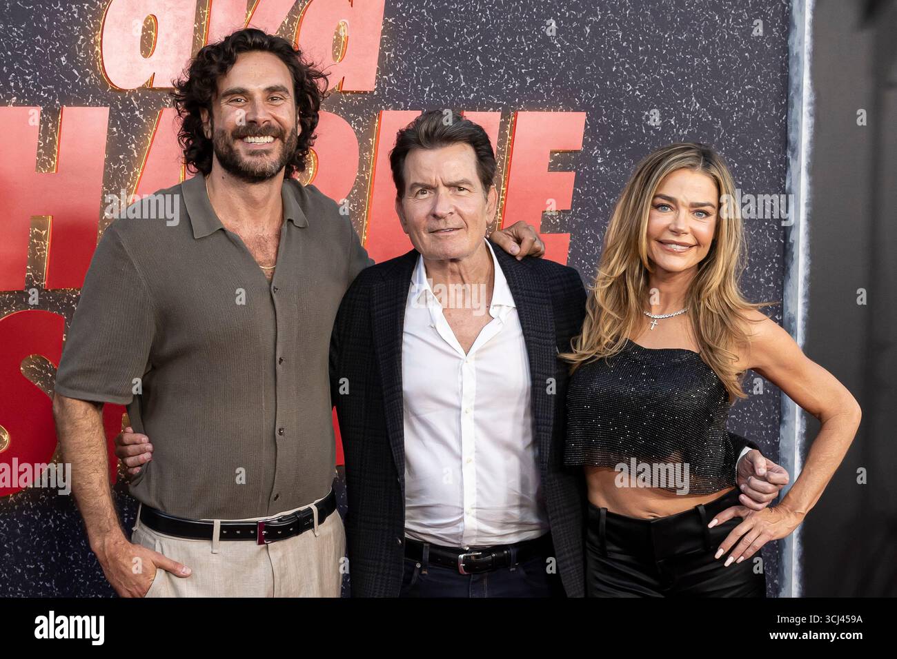 Andrew Renzi, Charlie Sheen and Denise Richards attend the arrivals of Netflix’s “aka CHARLIE ...