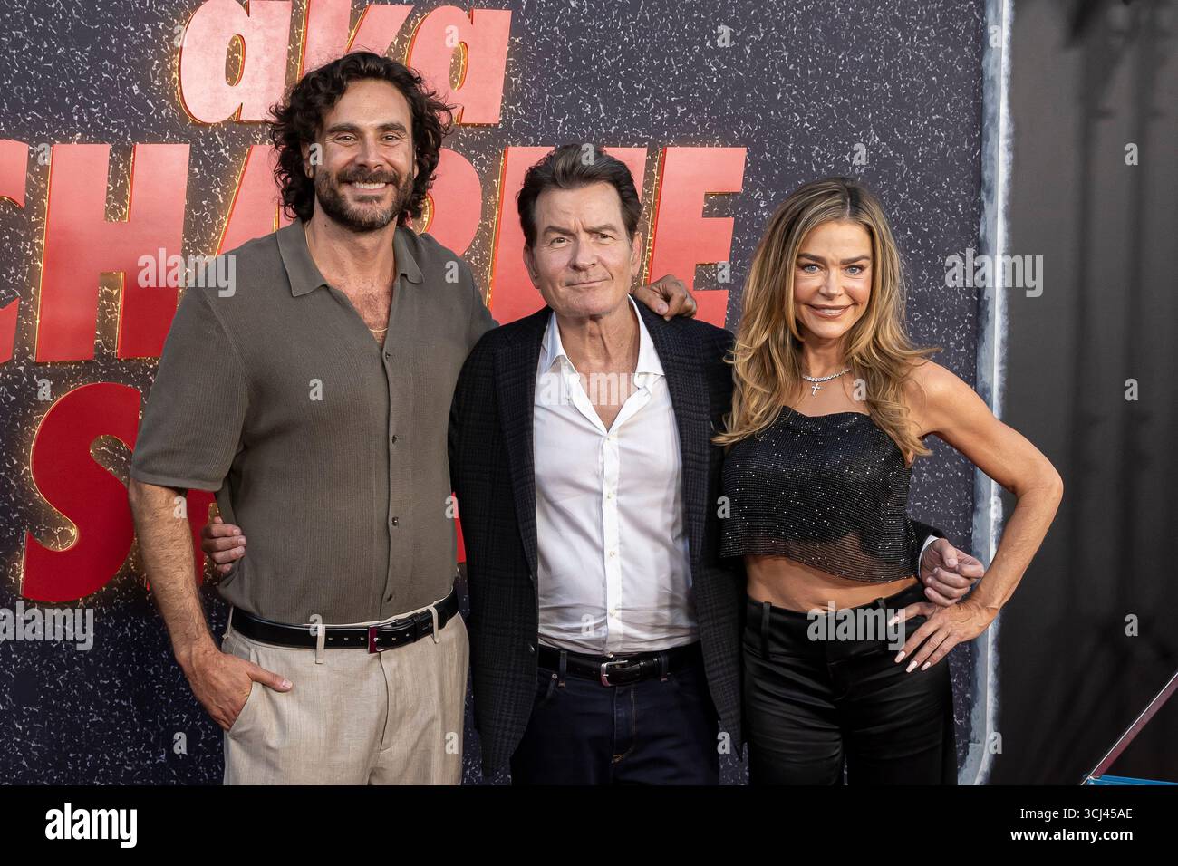 Andrew Renzi, Charlie Sheen and Denise Richards attend the arrivals of Netflix’s “aka CHARLIE ...