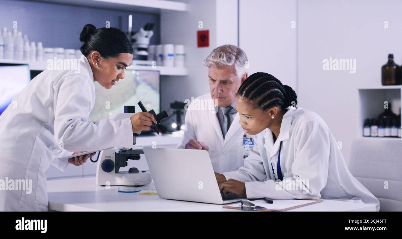Laptop, research and team of scientists in laboratory for medical study ...