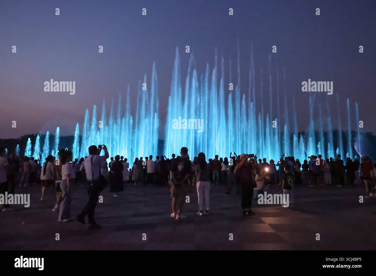 **CHINESE MAINLAND, HONG KONG, MACAU AND TAIWAN OUT** People watch ...