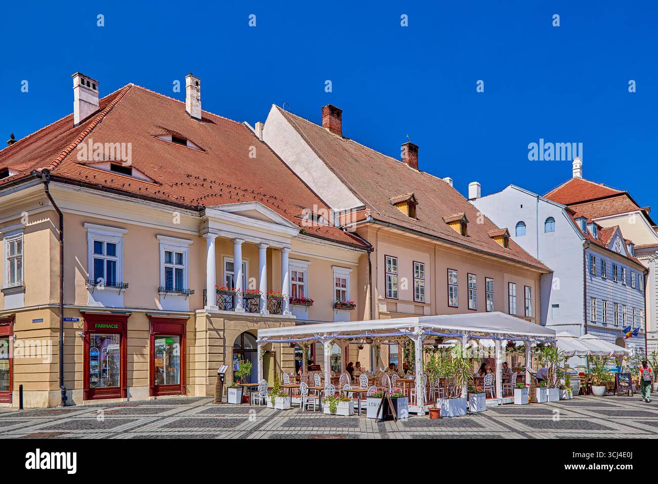 Street cafe's and restaurants lining the cobblestone streets of the of ...