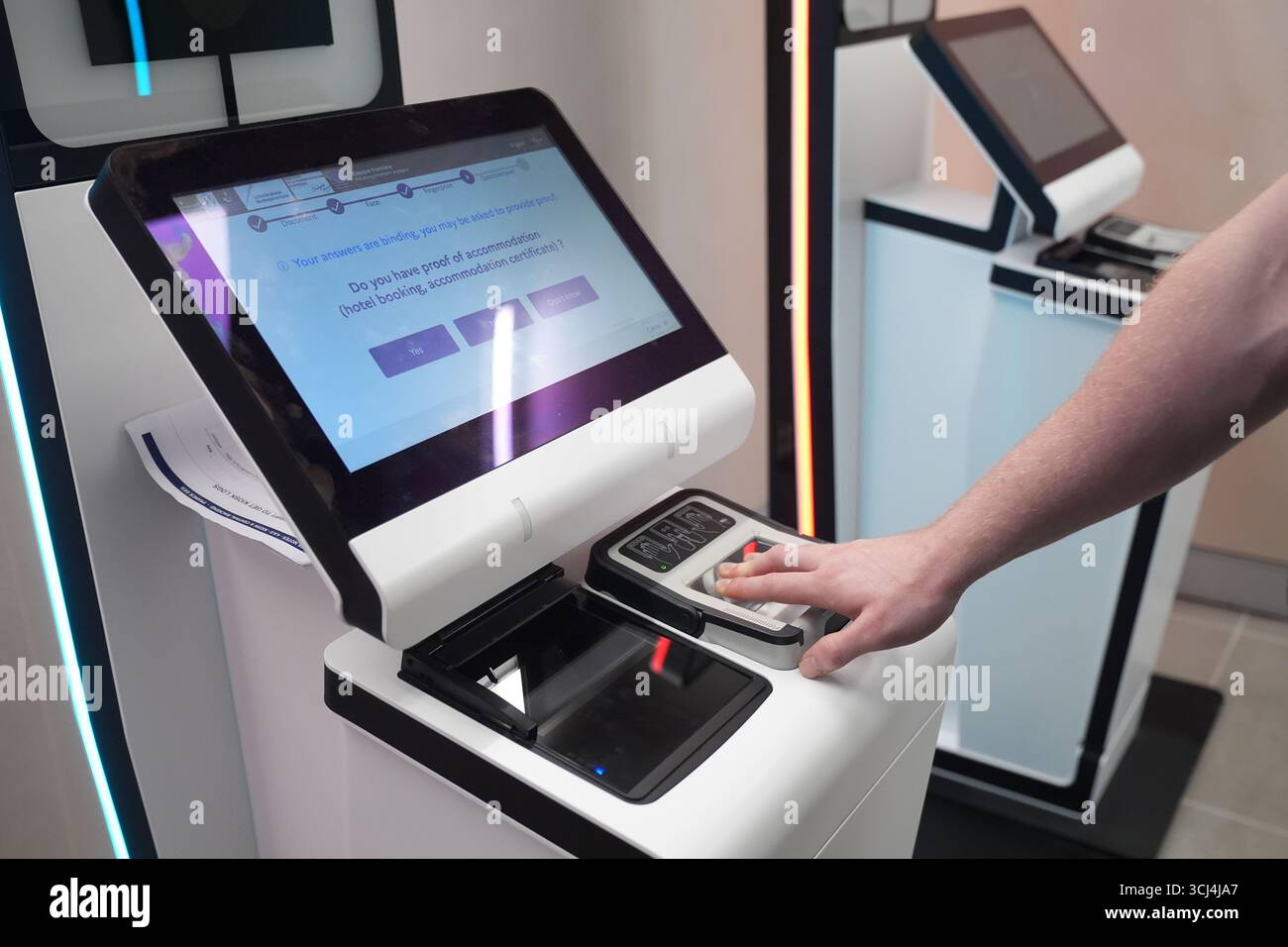 A person uses a EES kiosk during the preview at Kings Cross St Pancras ...