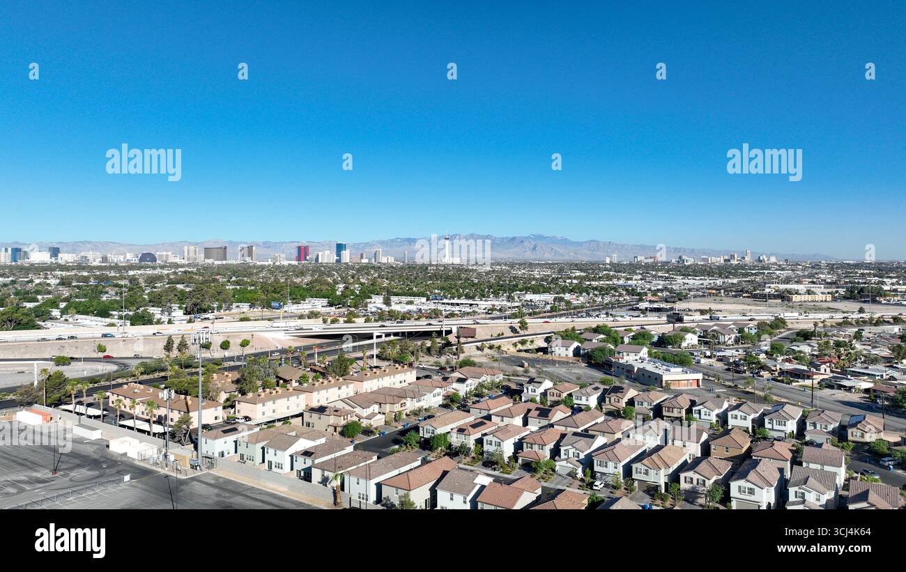 Aerial view of dense urban sprawl meets the horizon, speckled with ...