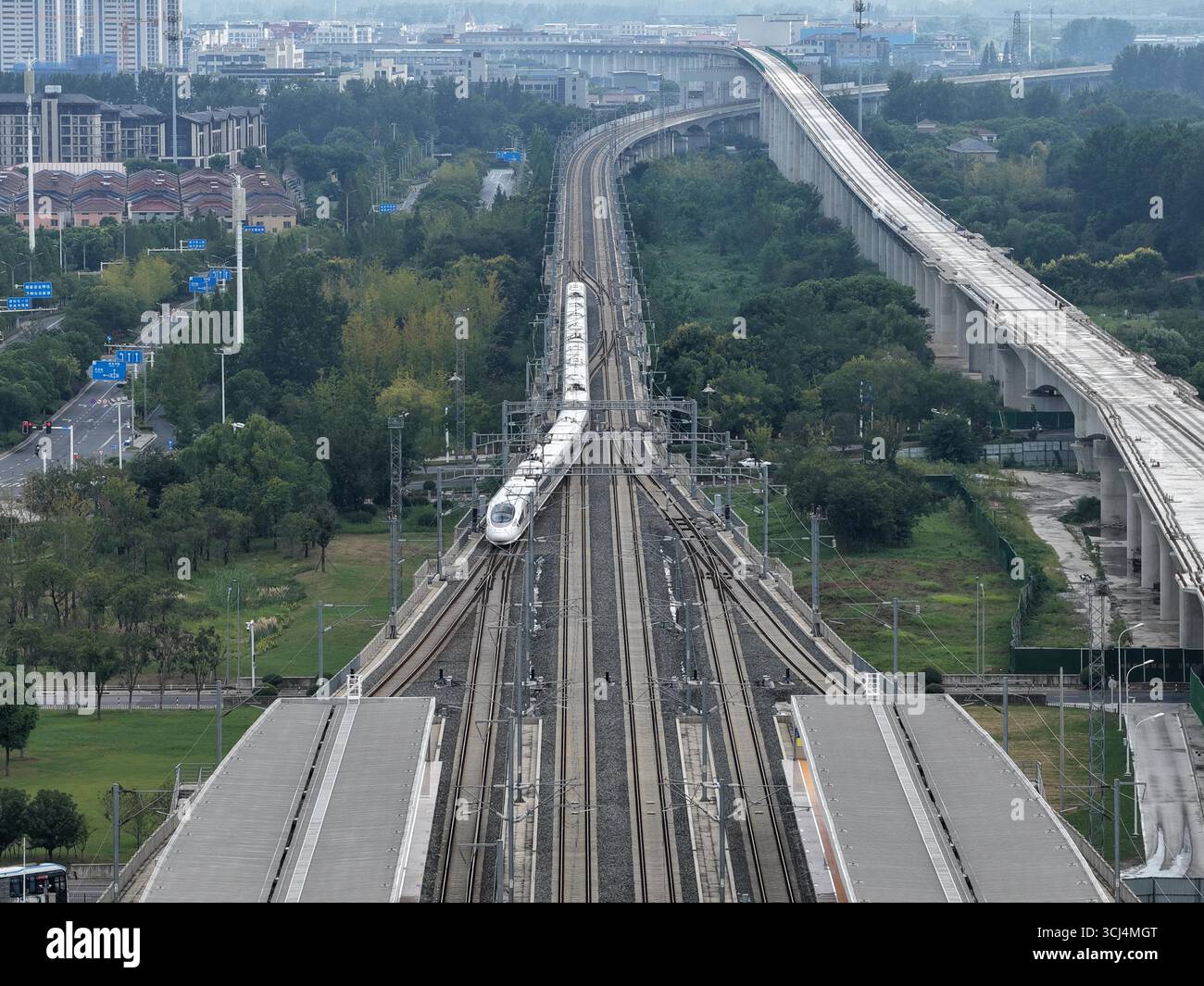 Passengers are seen at Yangzhoudong railway station in Yangzhou City ...