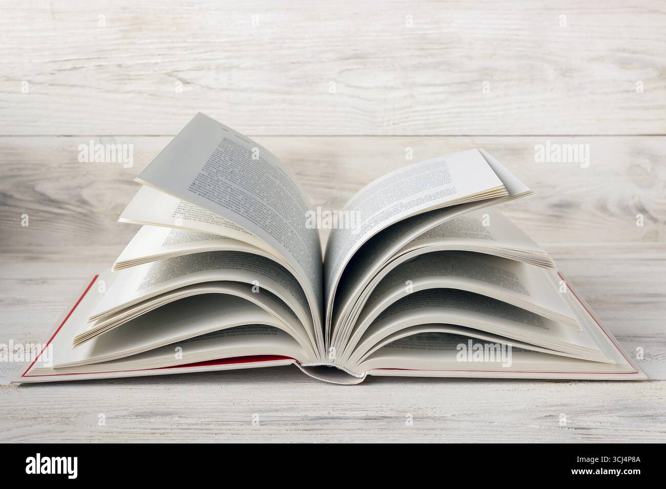 Open book lie hi-res stock photography and images - Alamy