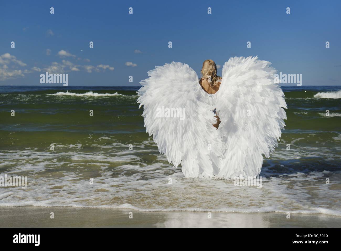 Woman angel wings on beach hi-res stock photography and images - Alamy