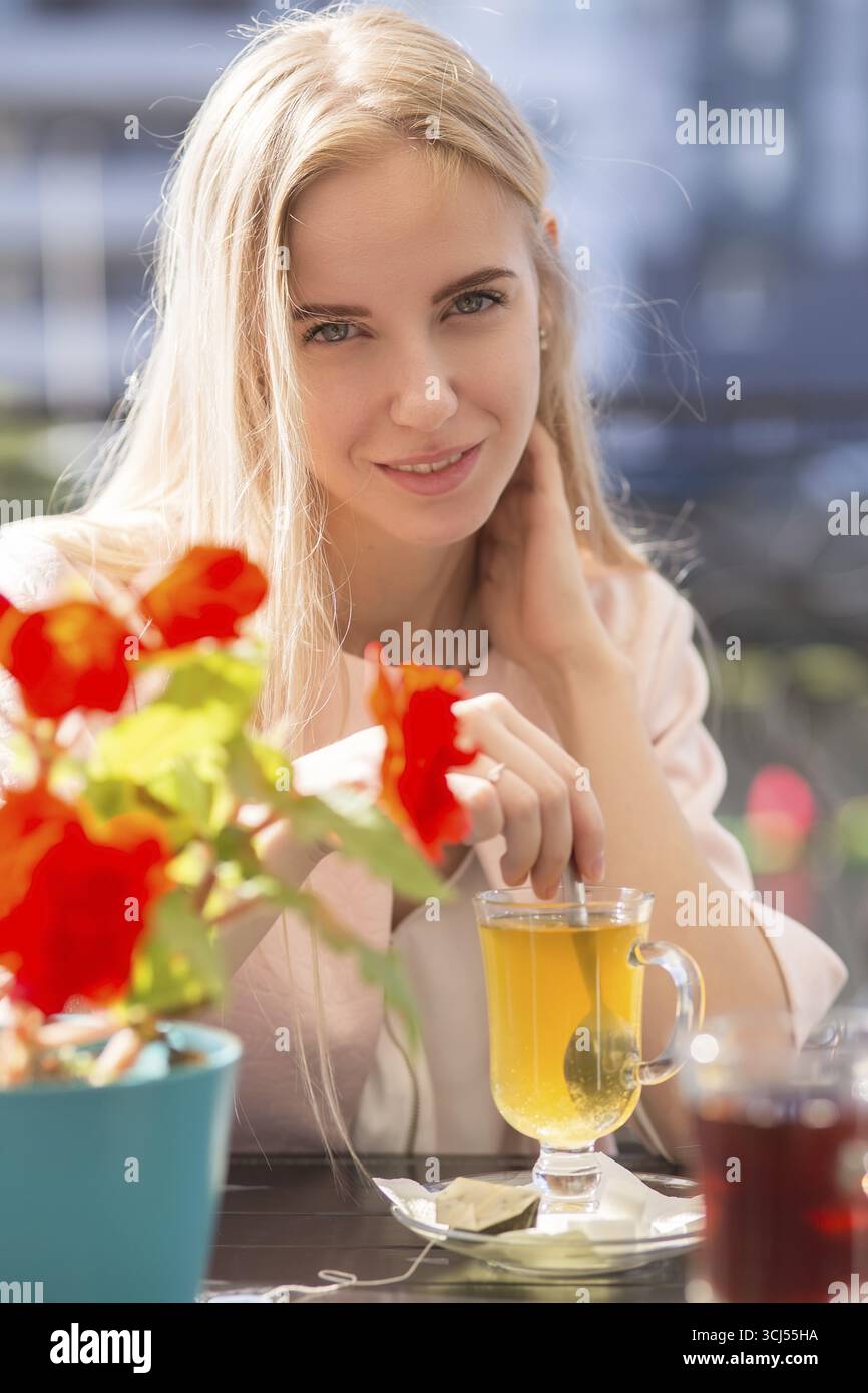 Portrait blond woman tea hi-res stock photography and images - Alamy