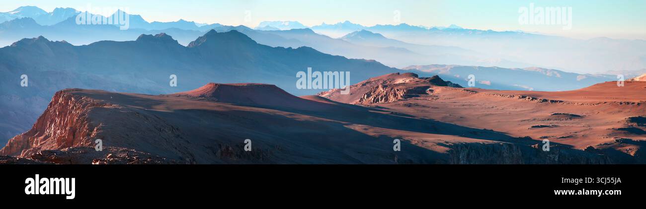 Backpackers camping in the Andes Mountains foothills, above the smog of ...