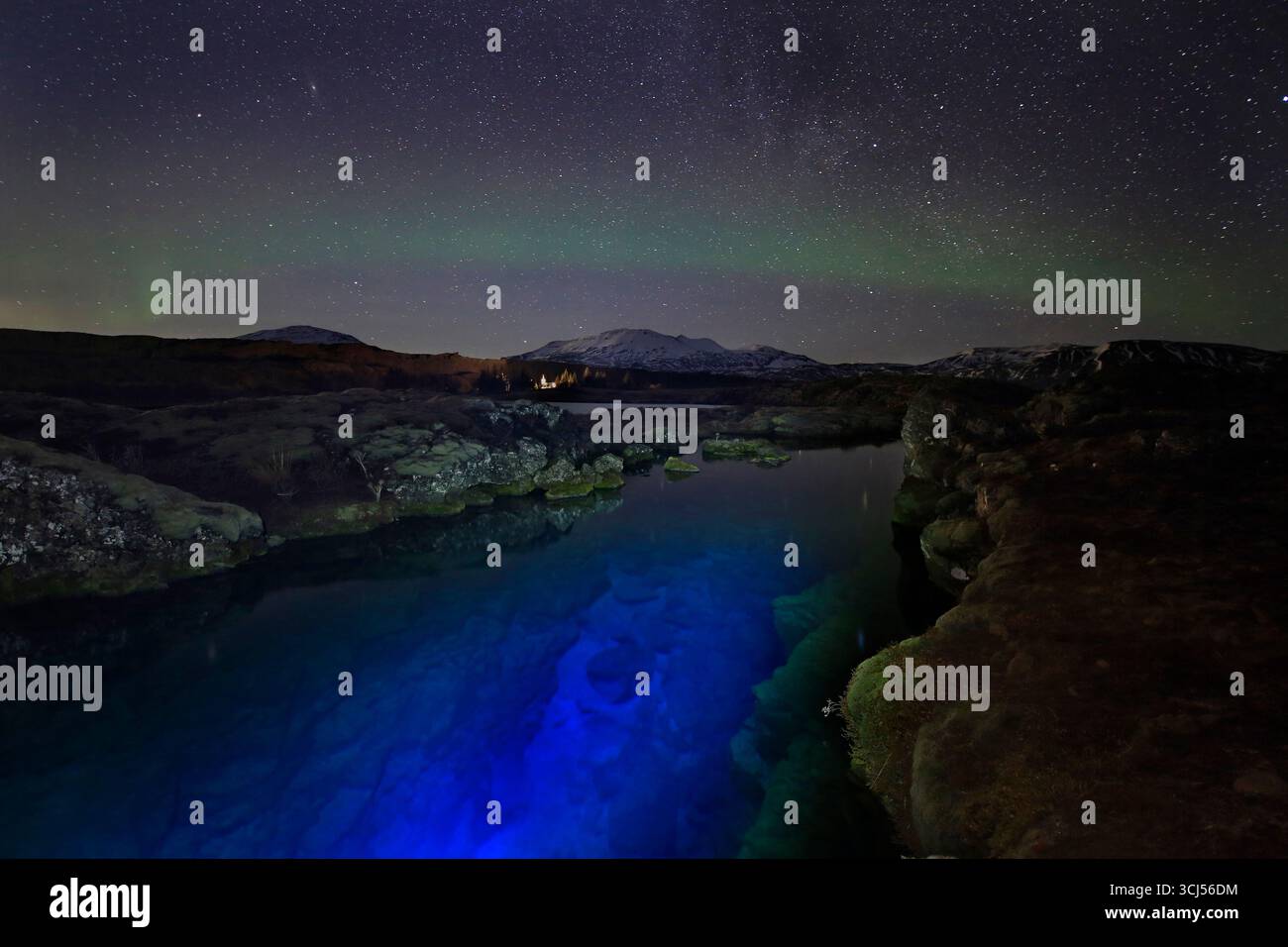 Aurora borealis display over Silfra tectonic plate crack Stock Photo ...
