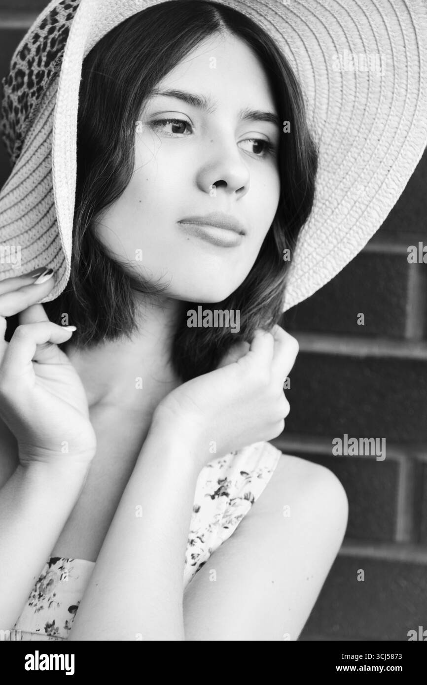 Young woman with sun hat Black and White Stock Photos & Images - Alamy