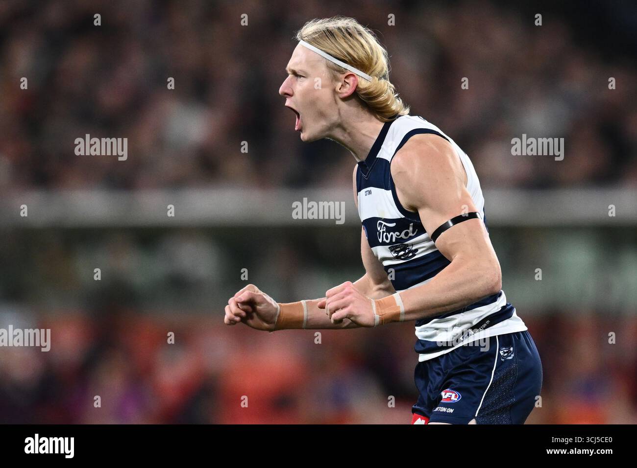 Oliver Dempsey of Geelong celebrates scoring a goal during the AFL ...