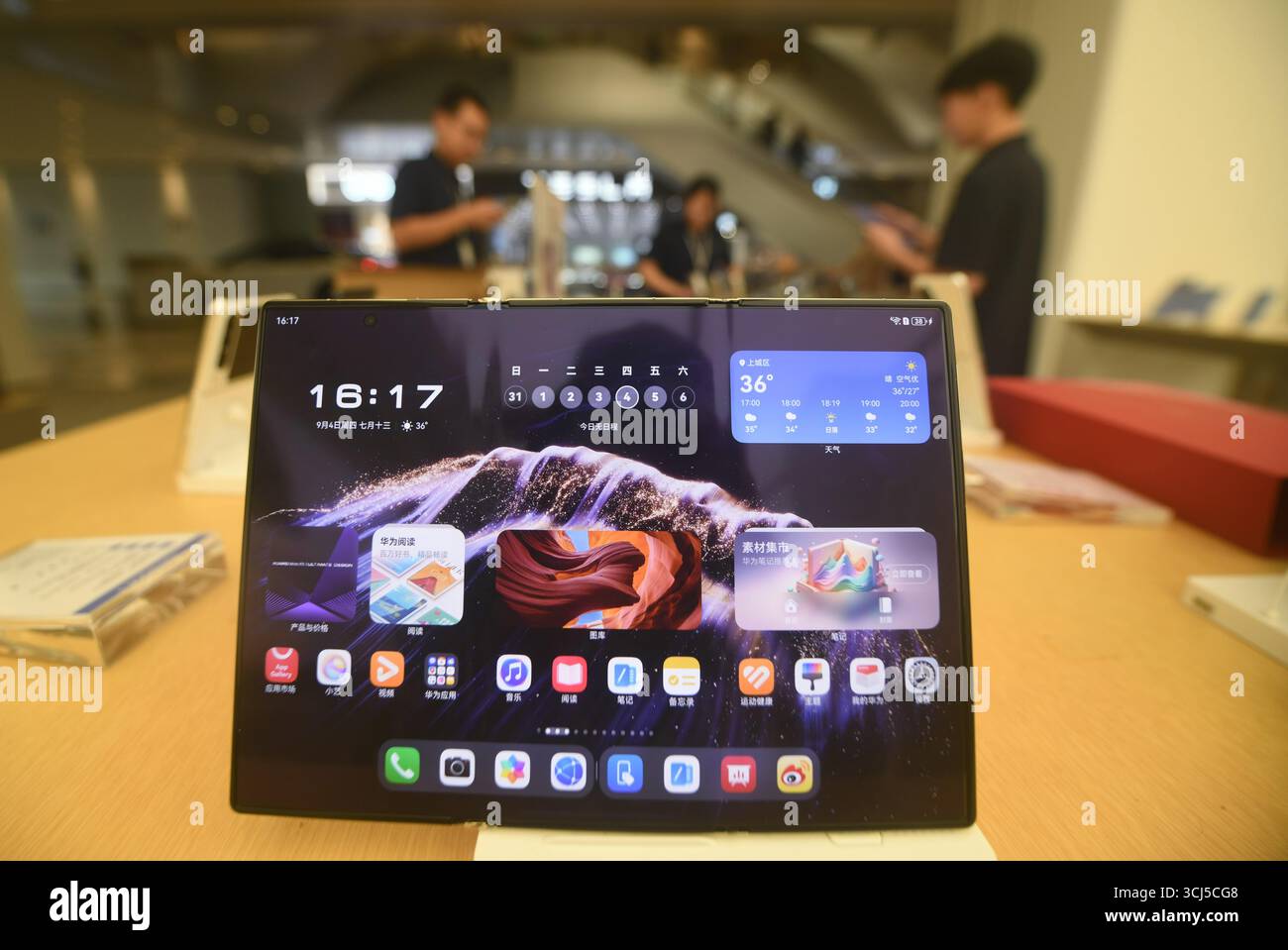 Huawei's tri-fold phone Huawei Mate XTs attracts customers at a Huawei ...