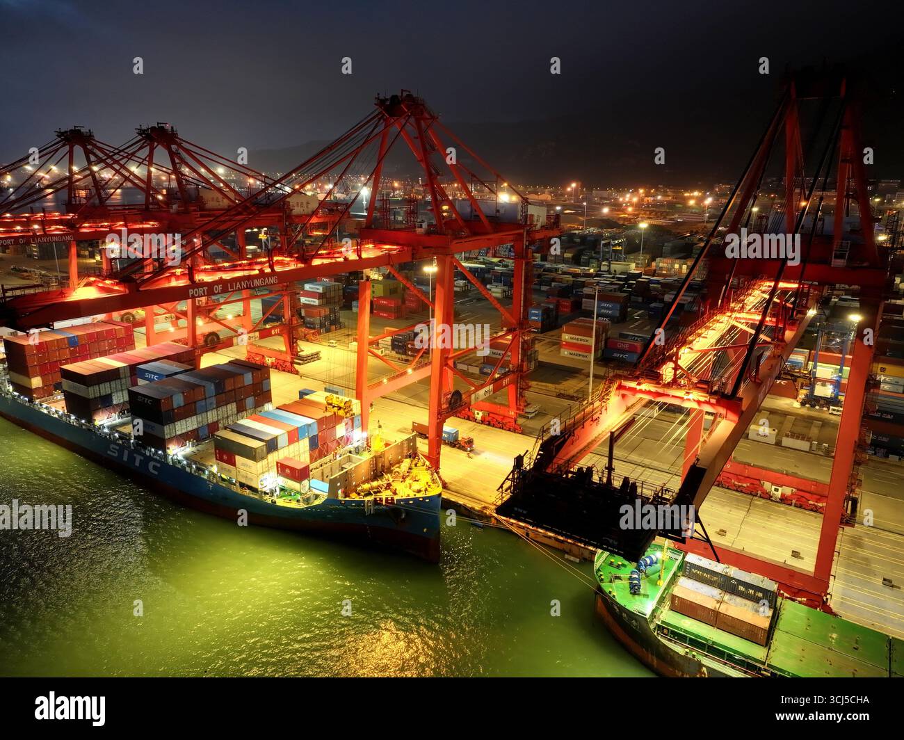 Aerial photo shows the container terminal of Lianyungang Port at night ...