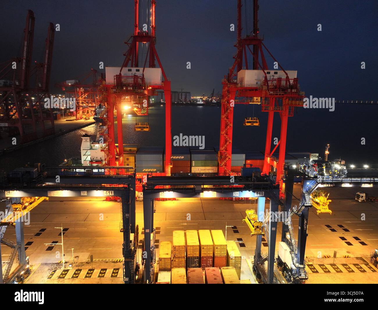 Aerial photo shows the container terminal of Lianyungang Port at night ...