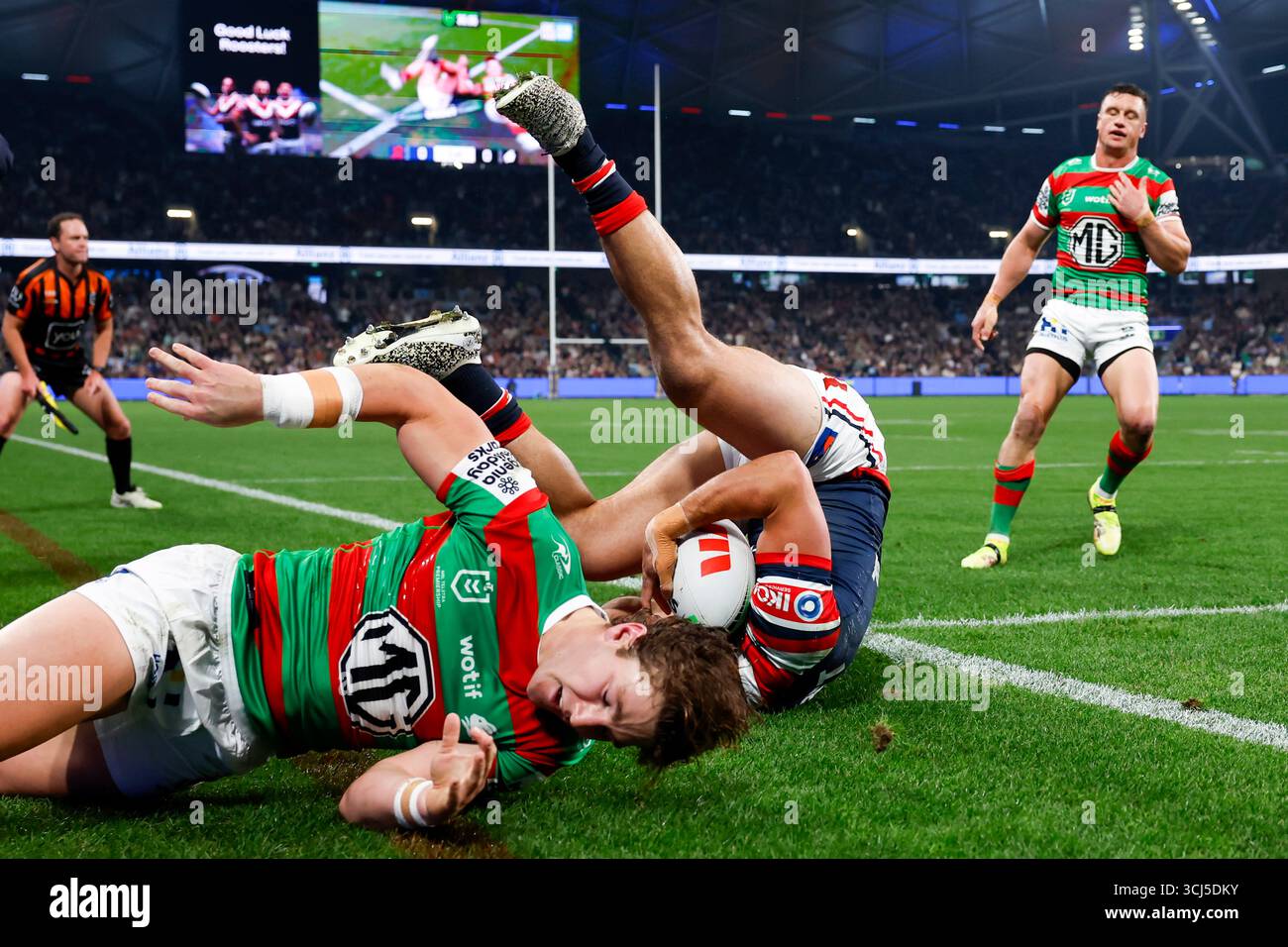 Mark Nawaqanitawase of the Roosters scores a try during the NRL Round ...