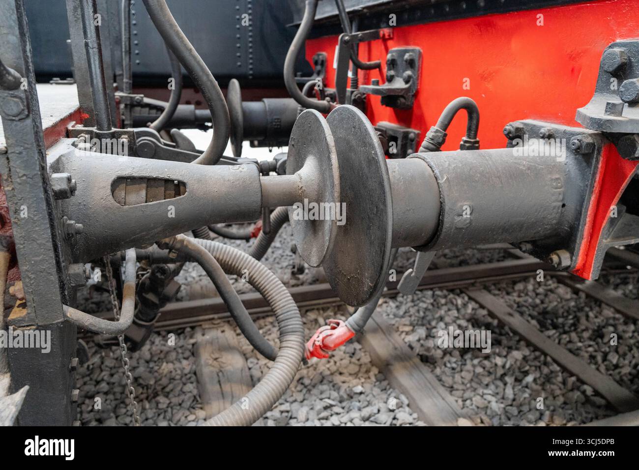 Close-Up of Train Wagon Connection, Hydraulic Pipes, and Mechanical ...