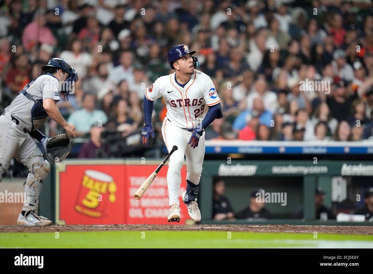 Houston Astros' Ramon Urias (29) watches his sacrifice fly go out to ...