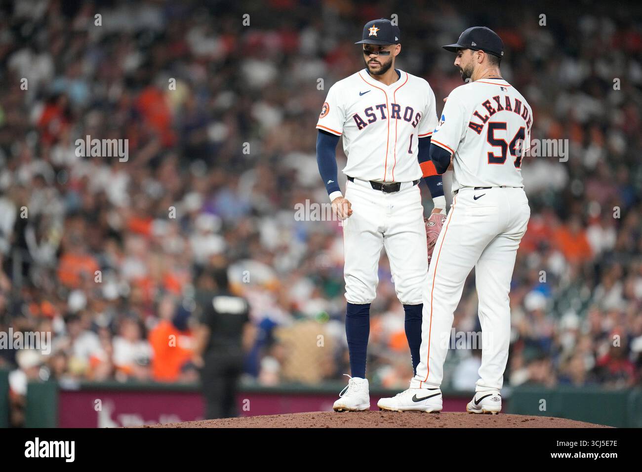 Houston Astros third baseman Carlos Correa (1) talks with starting ...
