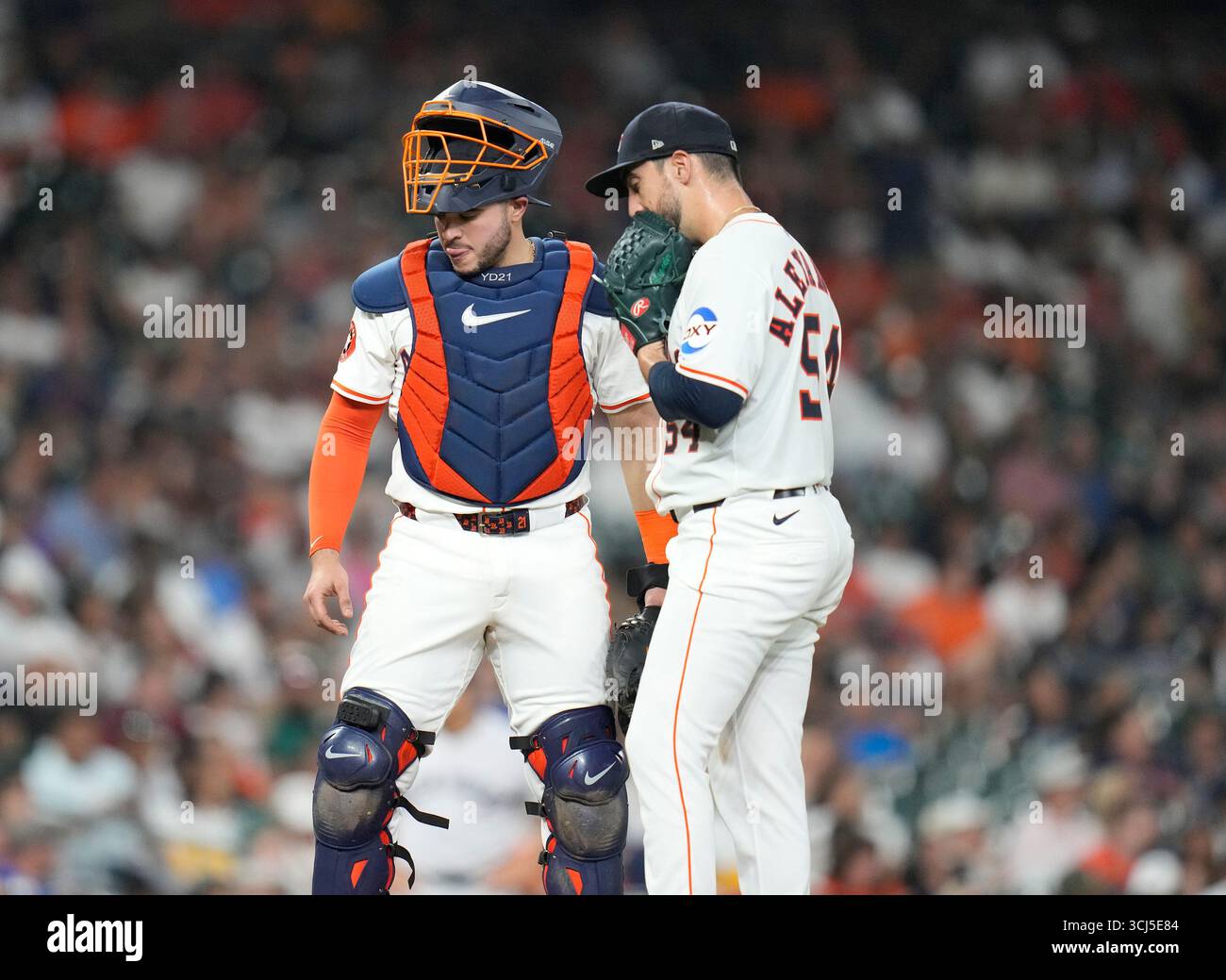 Houston Astros starting pitcher Jason Alexander (54) talks with catcher ...