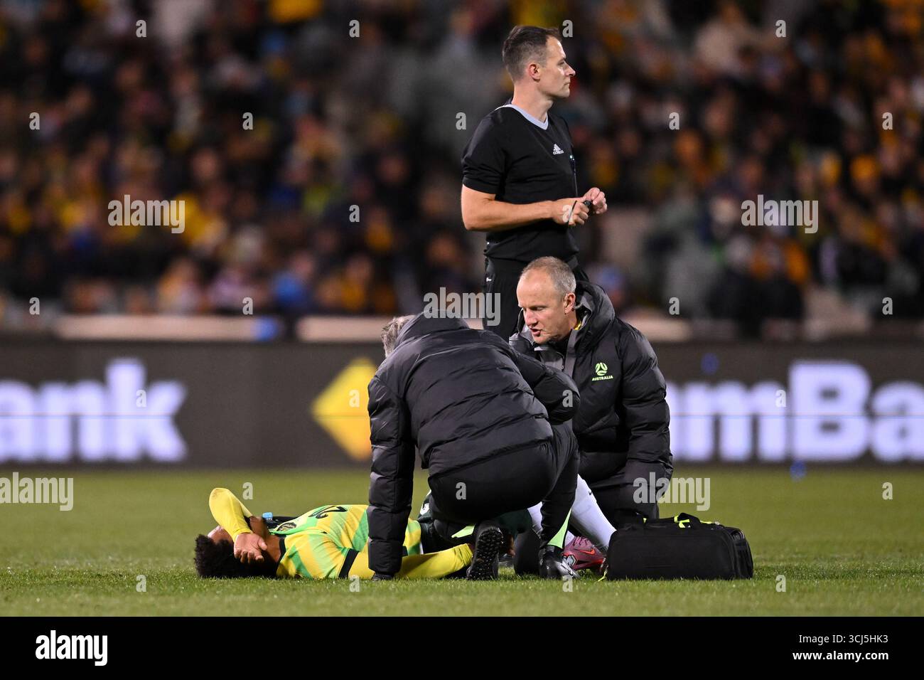 Samuel Silvera of Australia receives medical attention during the ...