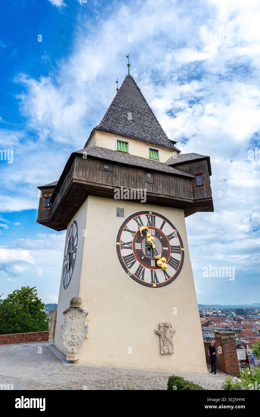 Uhrturm clock tower on Schlossberg hill with large clock face and ...