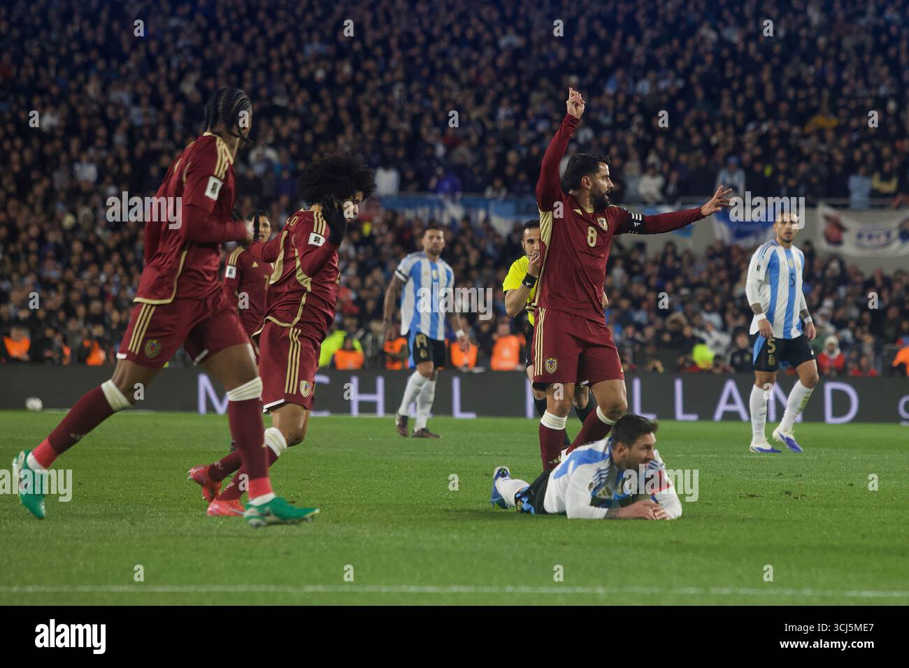 Lionel Messi and Tomás Rincón of Argentina are seen in action during ...