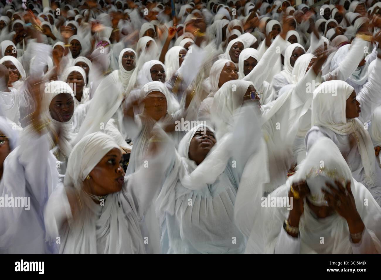 Women sing and gesture as they mark Prophet Muhammad's birthday, known ...