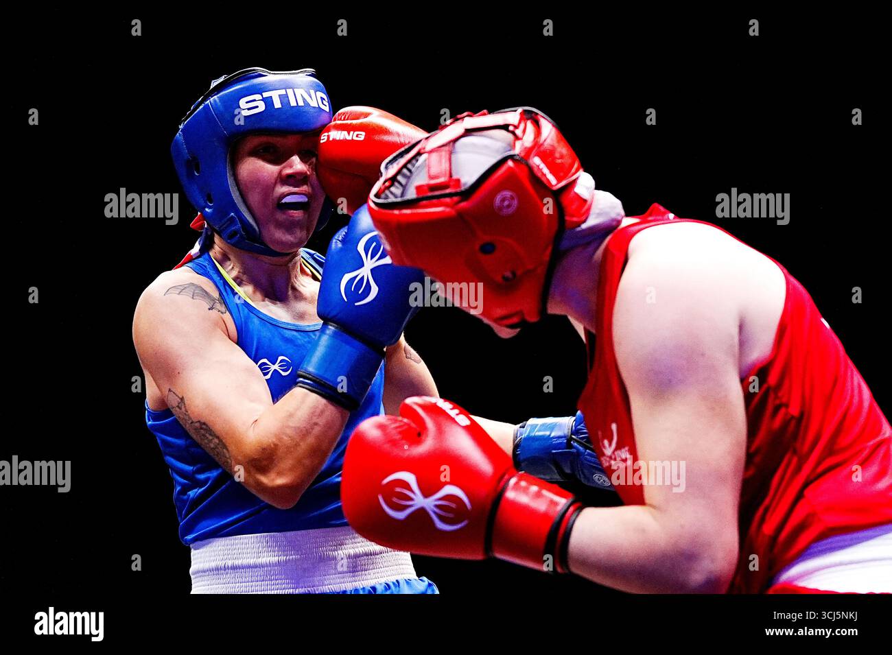 Caitlin Rainey (right) in action during their round of 32 bout against ...