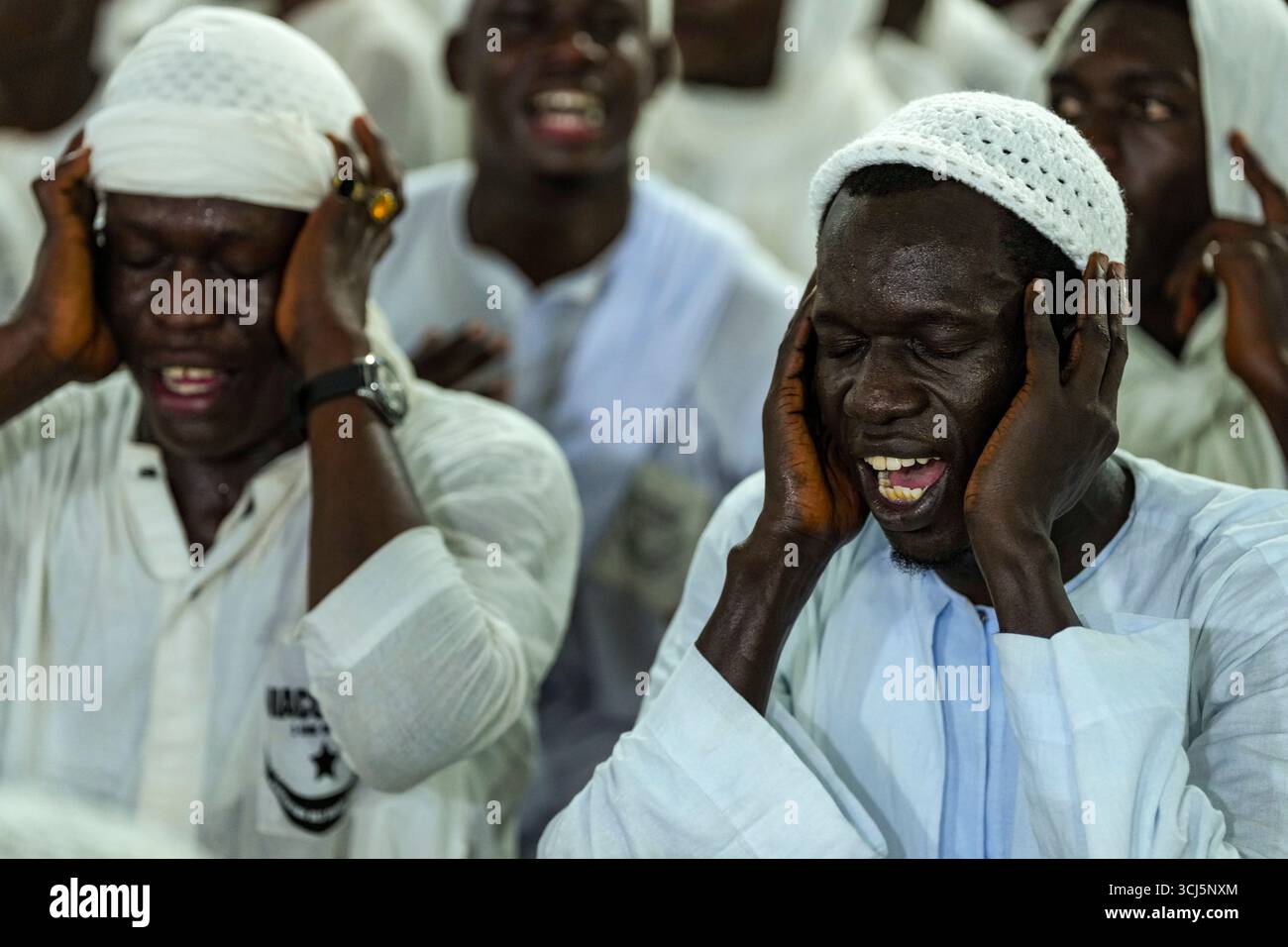 Men recite prayers as they mark Prophet Muhammad's birthday, known as ...