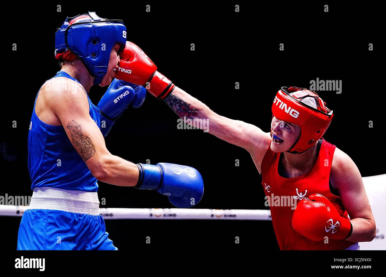Caitlin Rainey (right) in action during their round of 32 bout against Madeleine Elisabeth ...
