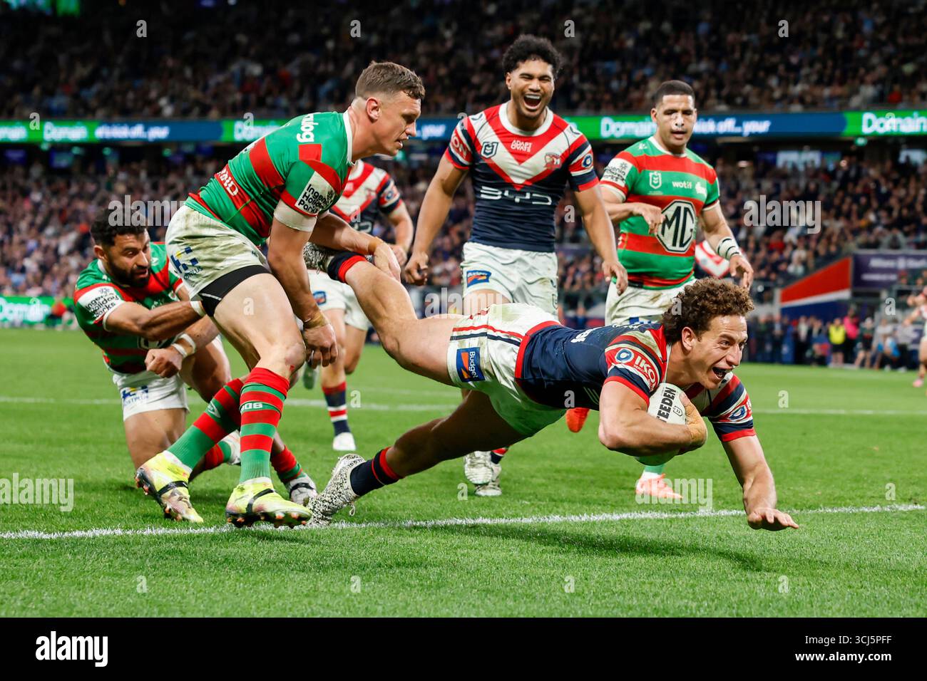 Mark Nawaqanitawase of the Roosters scores his third try during the NRL ...