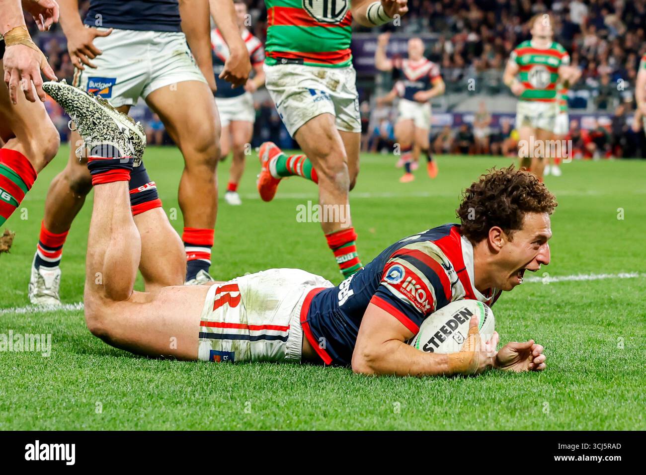 Mark Nawaqanitawase of the Roosters scores his third try during the NRL ...