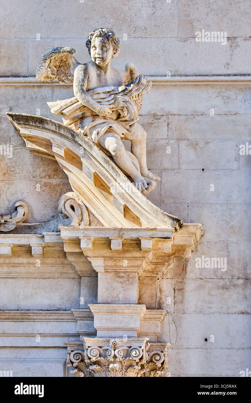 Angel statue on the front facade of St. Ignatius Church above the ...
