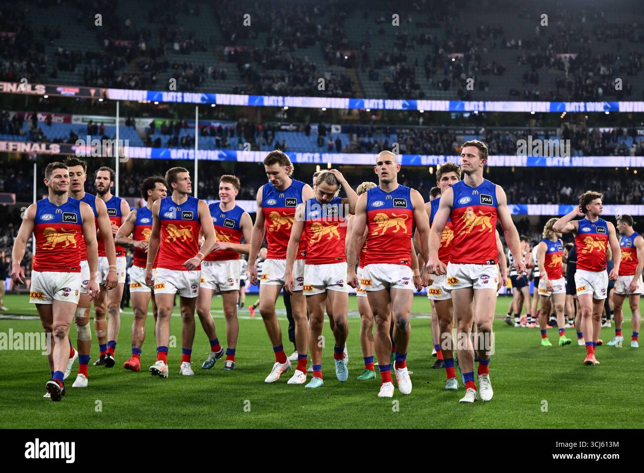Brisbane Lions players leave the field following the AFL Qualifying Final match between the ...
