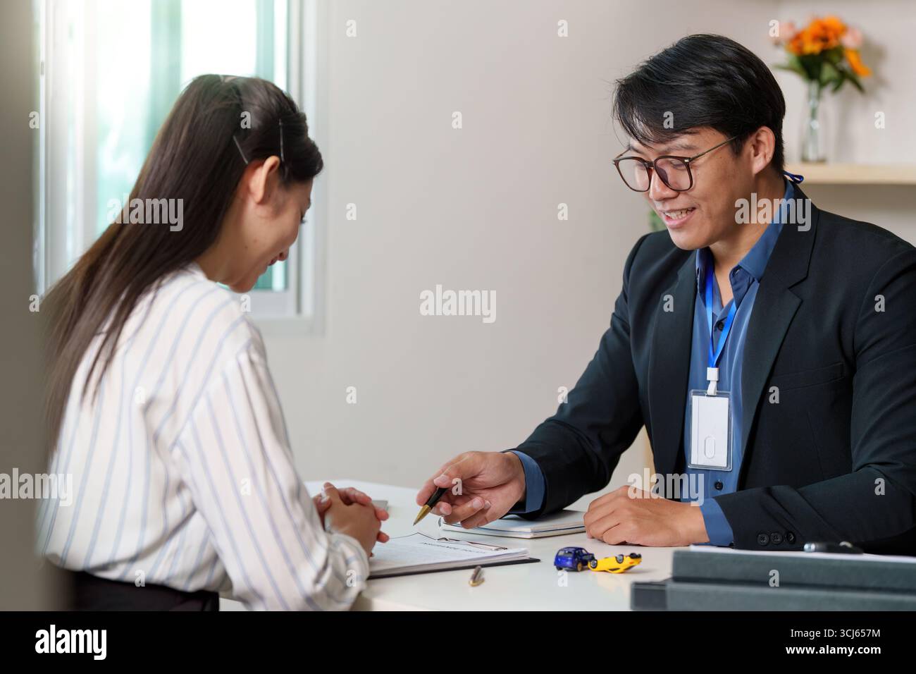 Car Insurance Meeting. Agent and client discussing policy details Stock ...