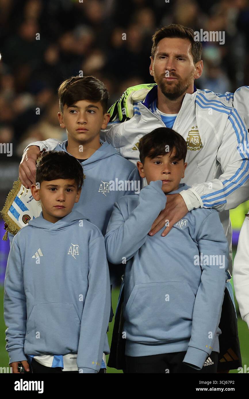 Argentina's forward Lionel Messi (R-back) and his three children ...
