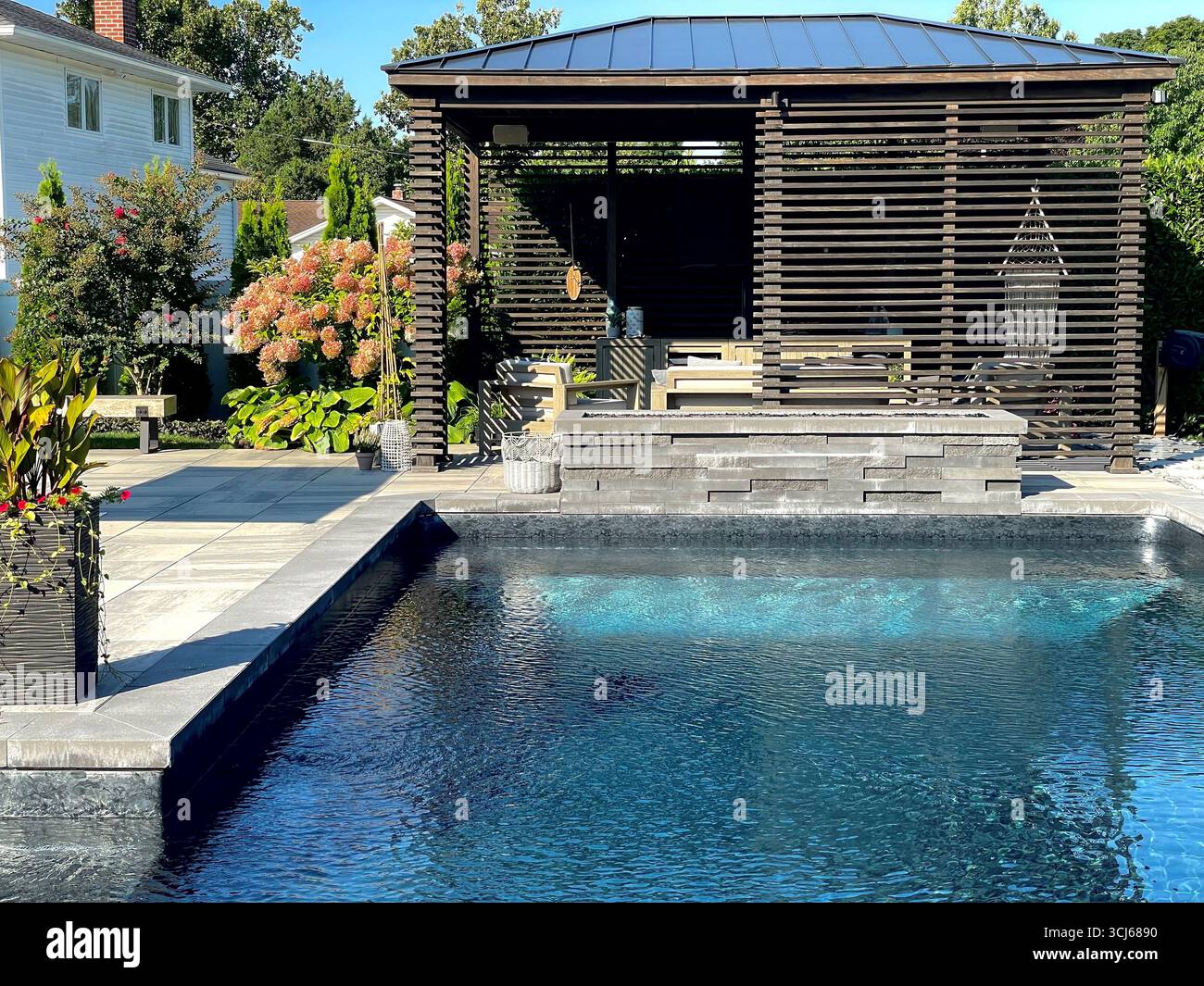 Modern luxury backyard pool, sundeck, dining set, garden fire pit, hot ...