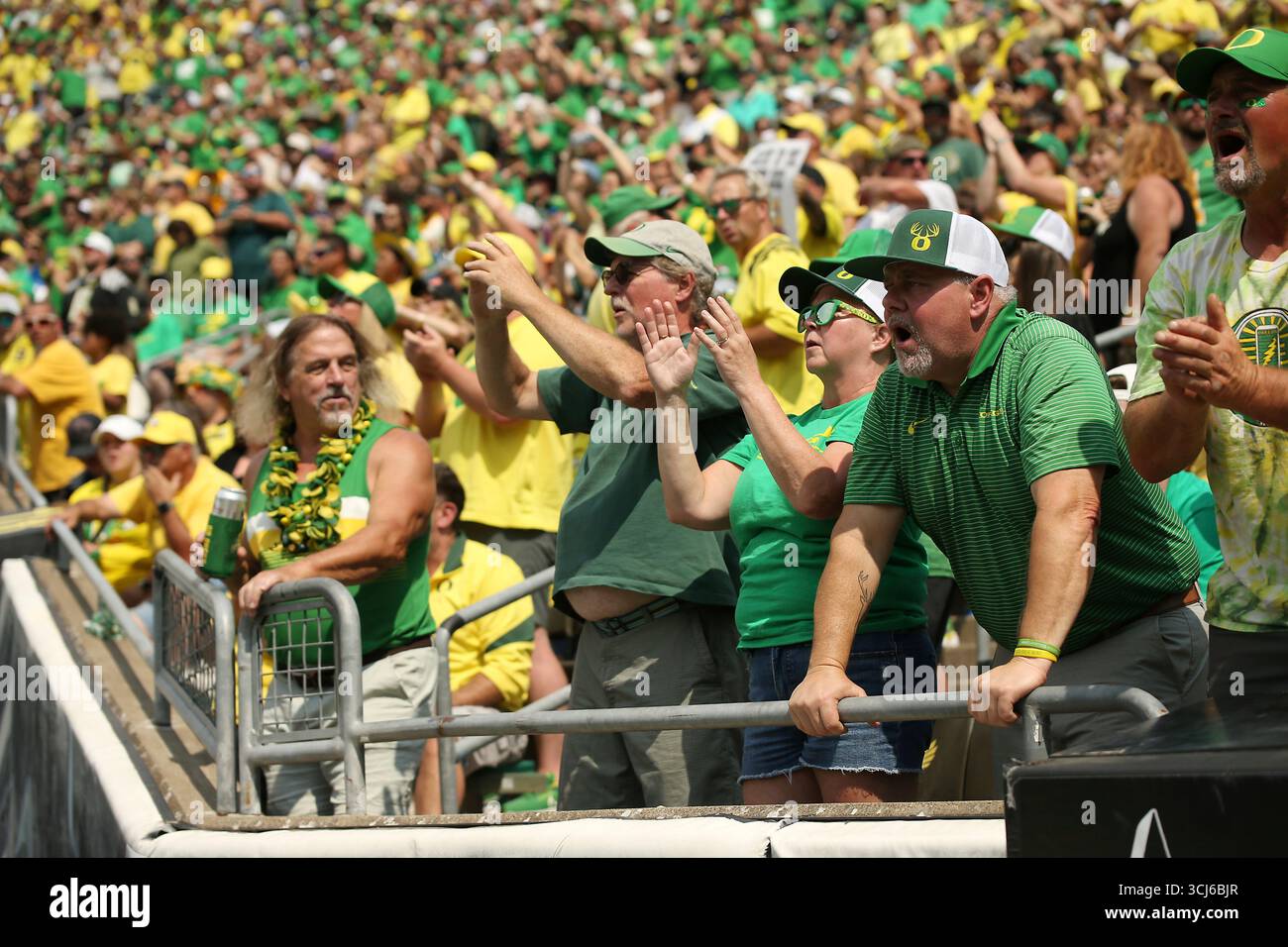Oregon fans cheer during the first half of an NCAA college football ...