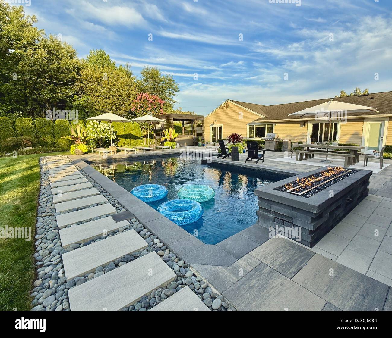 All season modern luxury high-end backyard living space. Fire pit, J ...