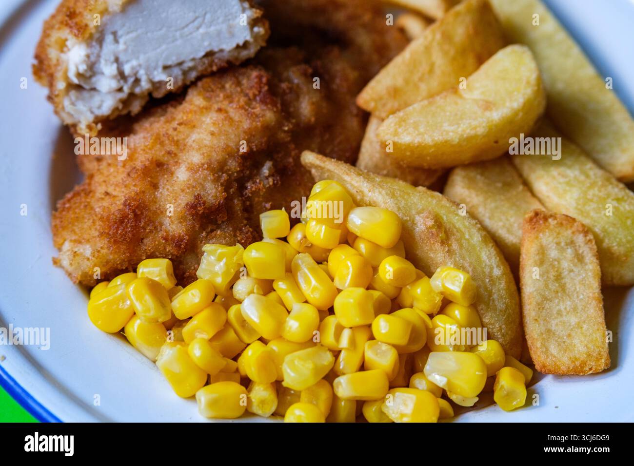 London UK, September 05 2025, Breaded Chicken Fillets With Chunky Chips ...