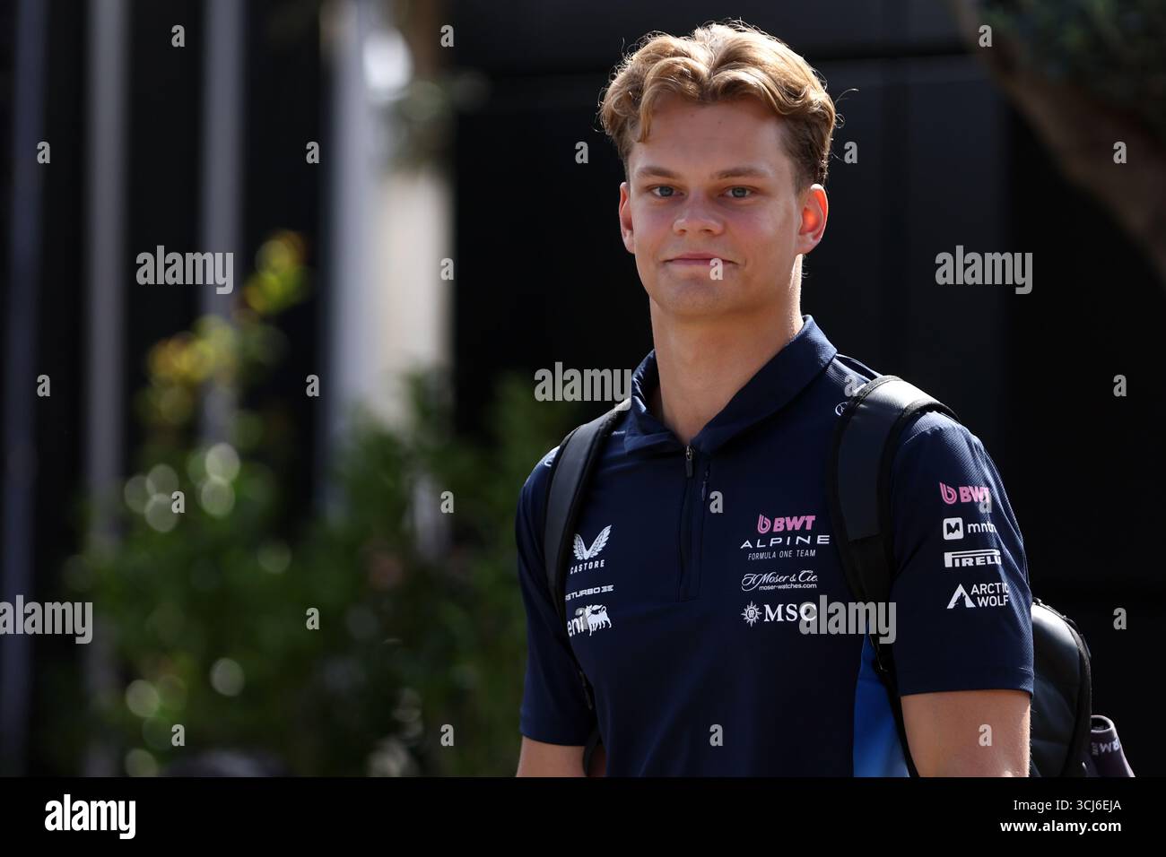 Paul Aron of Alpine Formula 1 looks on in the Paddock during free ...