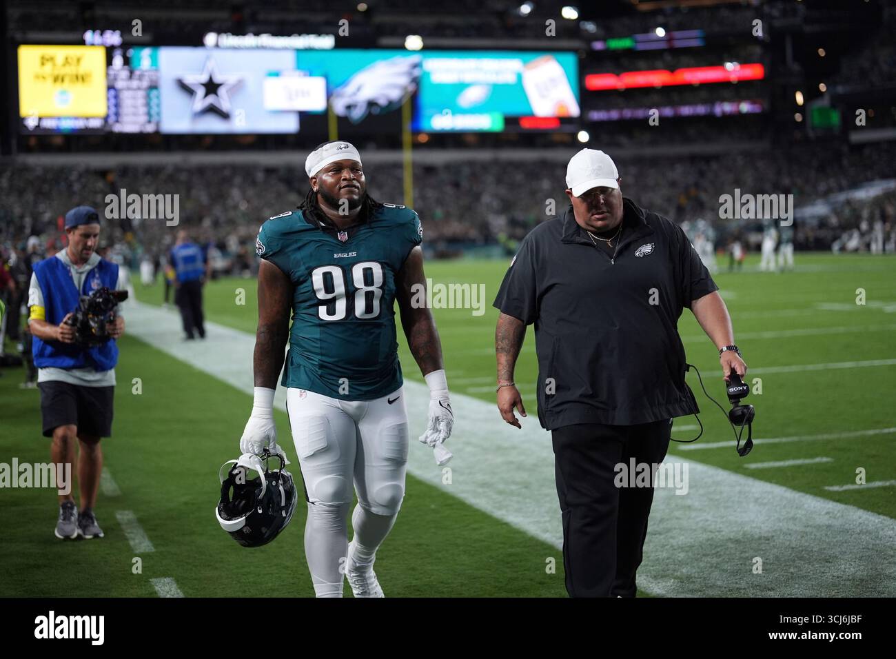 Philadelphia Eagles' Jalen Carter walks off the field after being ...