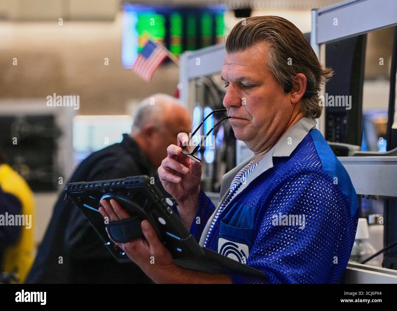 Options trader Ed Nangle works on the floor of the New York Stock ...