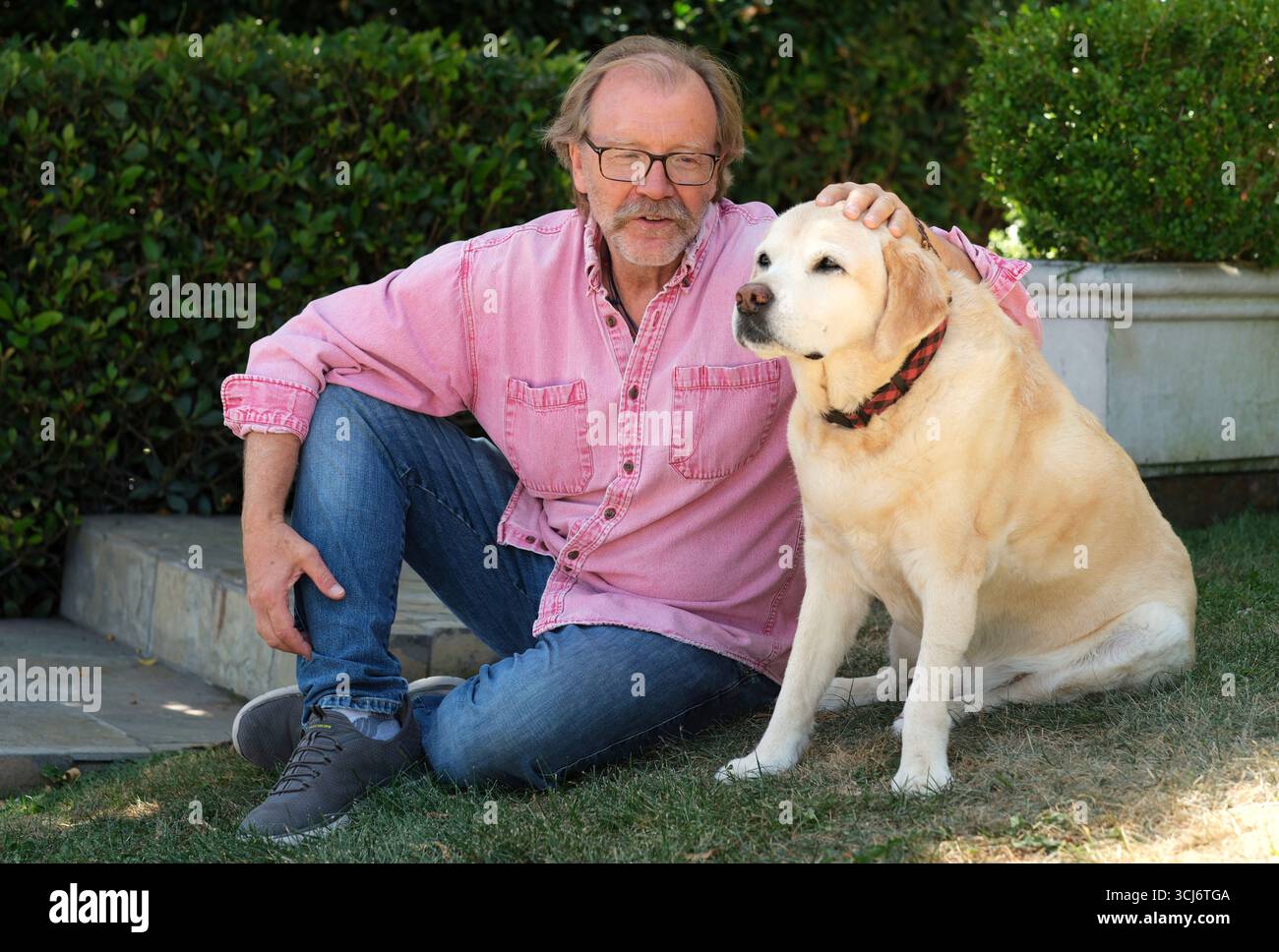 Author George Saunders poses for a portrait with Guin, his 13-year-old ...