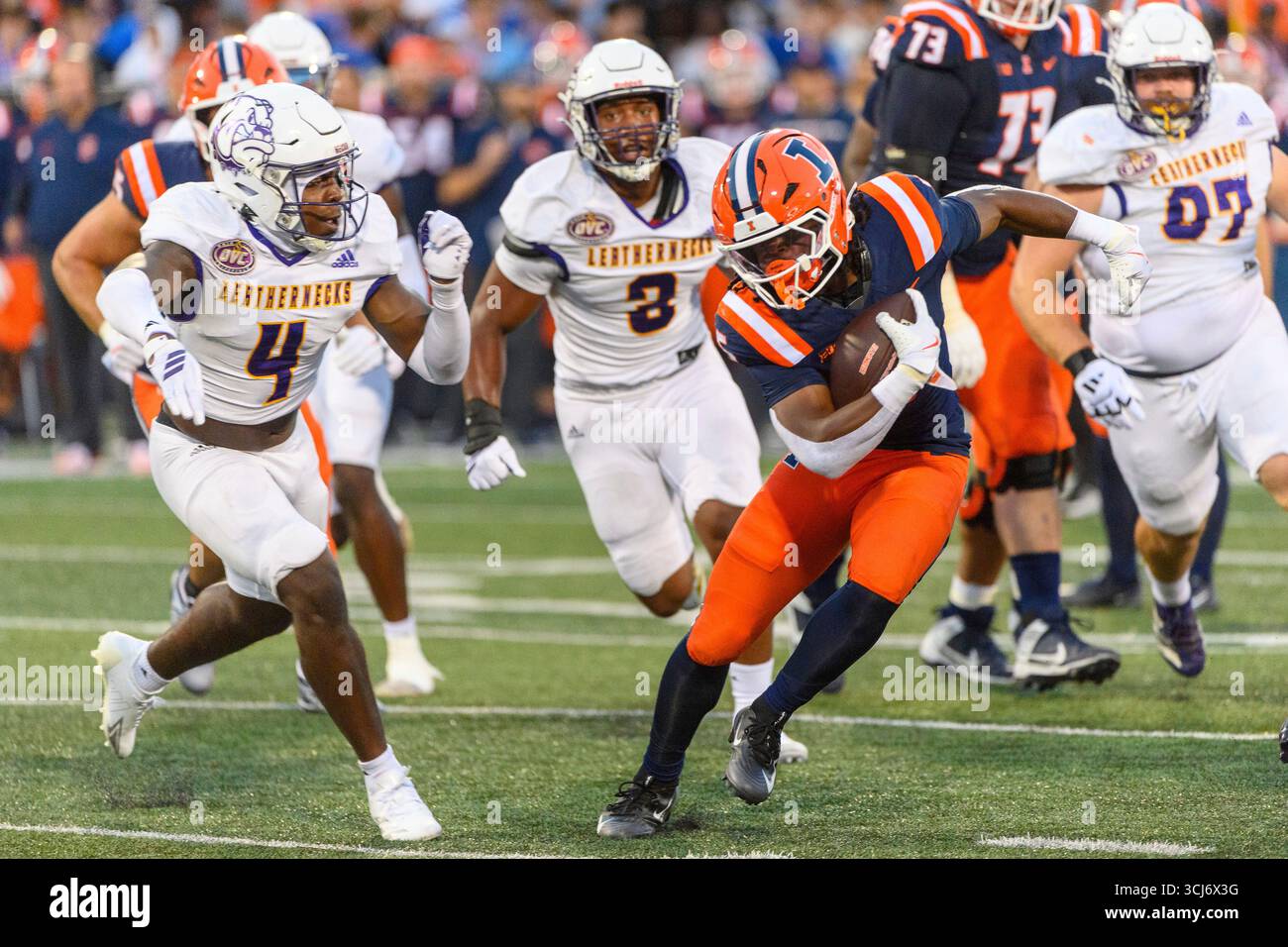 Illinois running back Ca'Lil Valentine (5) rushes the ball during the ...