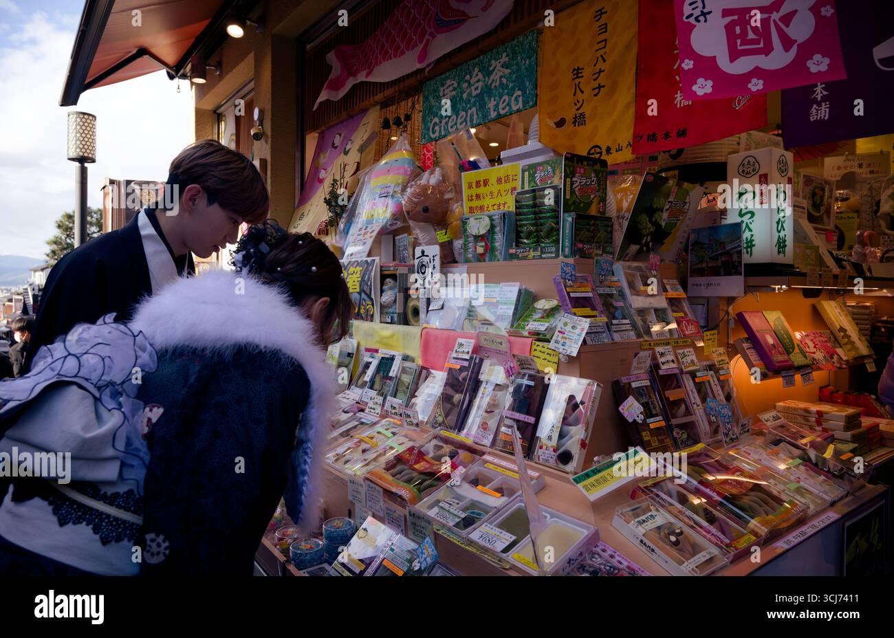 Kimono-clad visitors on Coming of Age Day browse through shelves of ...